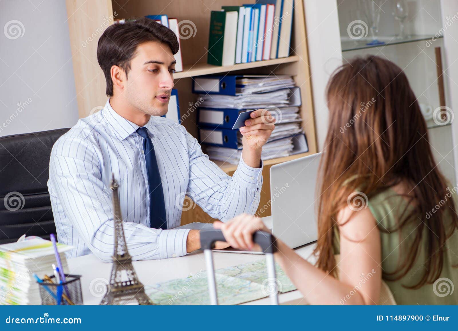 The Customer Visiting Travel Agency and Talking To Agent Stock Photo ...