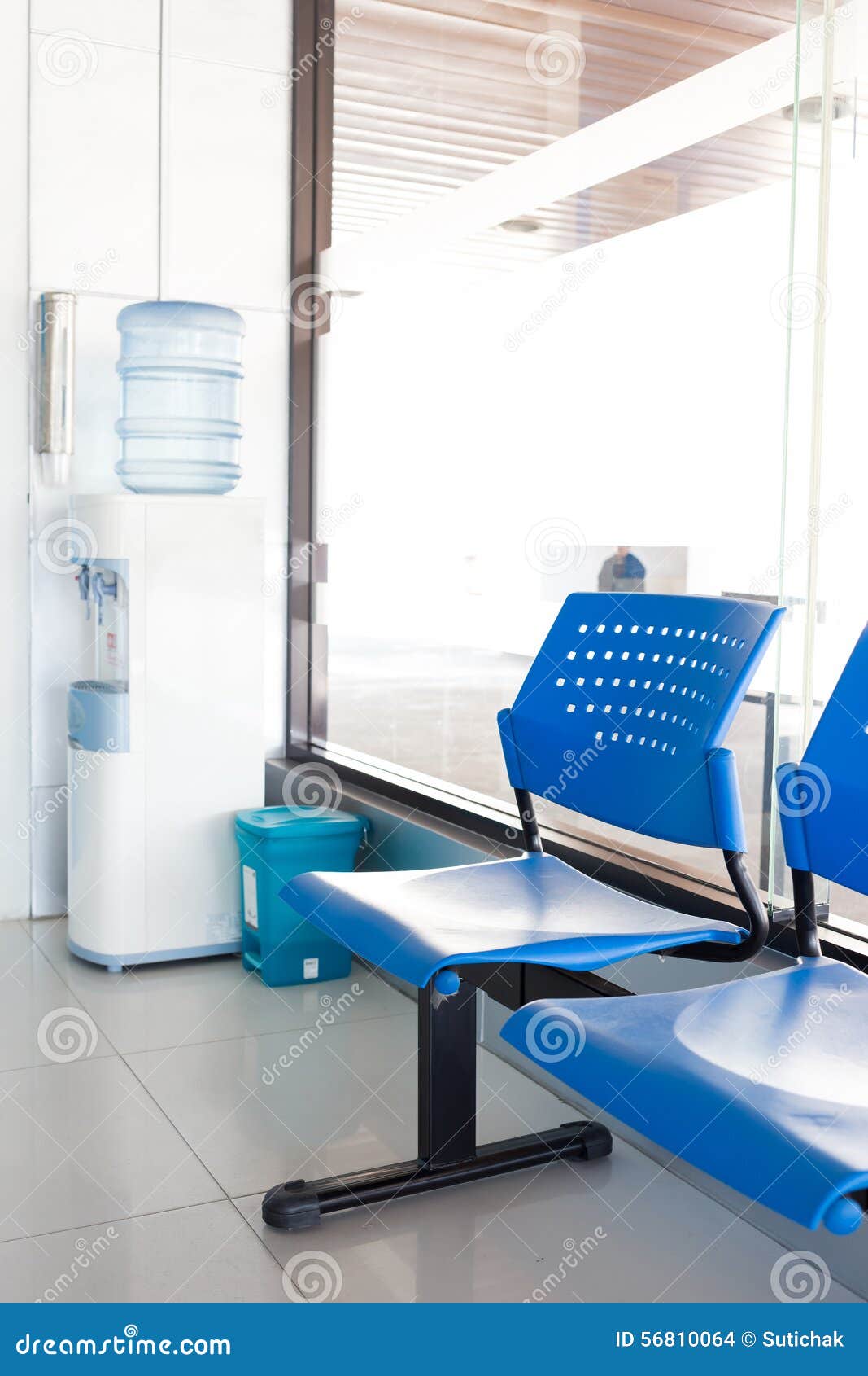 Customer Waiting Area with Rows of Blue Seats Stock Photo - Image of ...