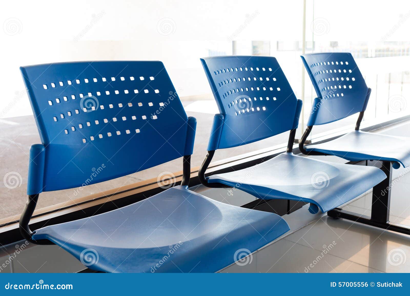 Customer Waiting Area with Rows of Blue Seats Stock Photo - Image of ...