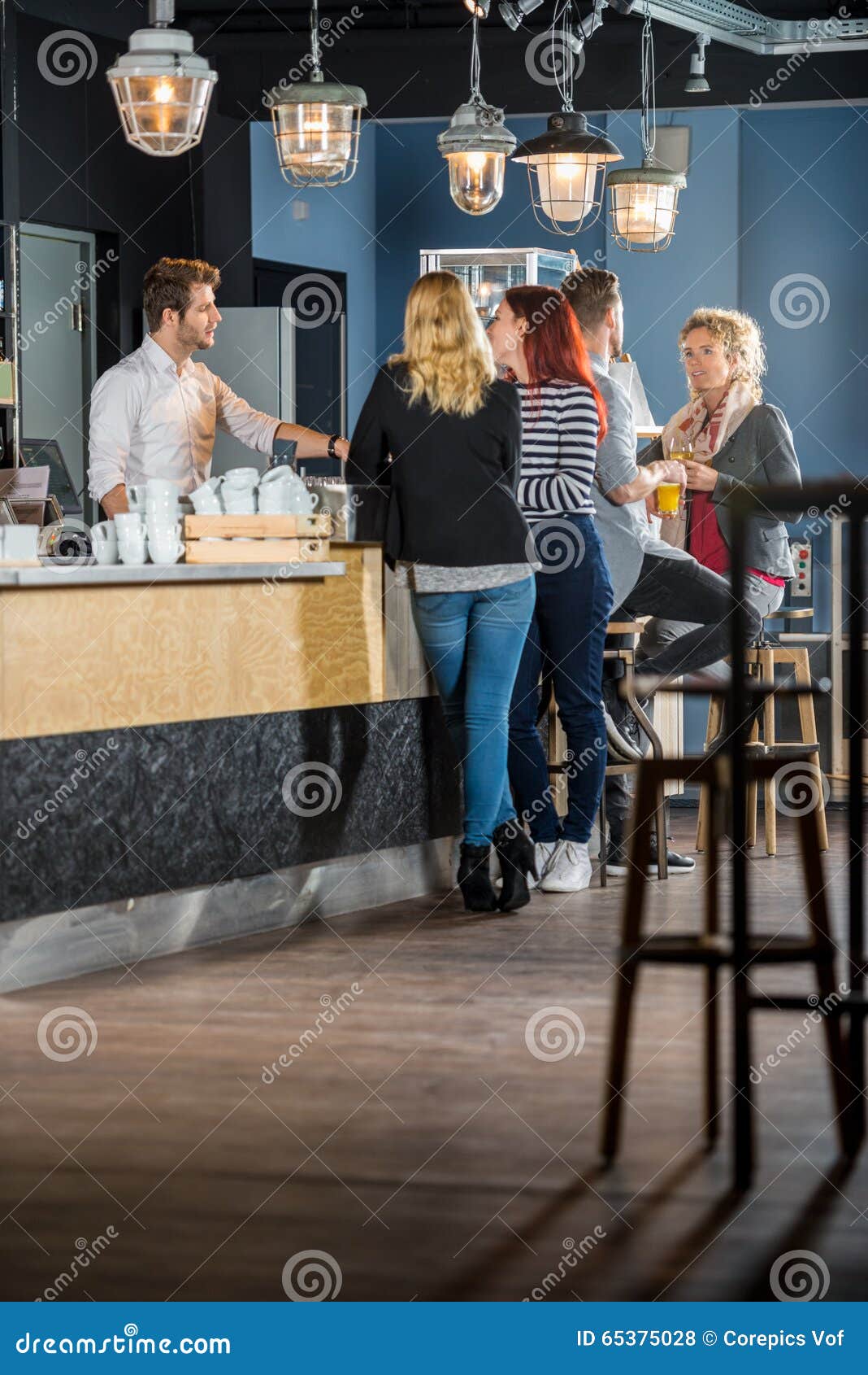 Customers with Bartender Standing at Counter Stock Photo - Image of ...