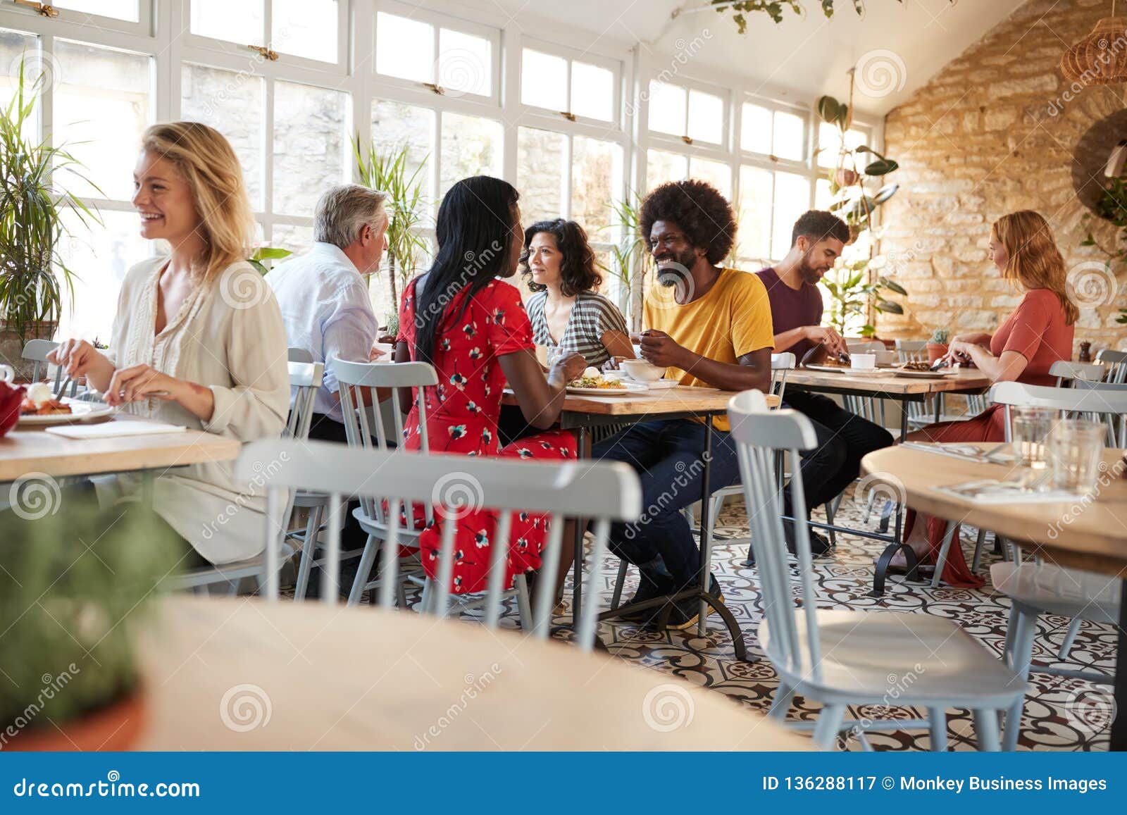 Customers Eating at a Busy Restaurant in the Day Time Stock Image ...