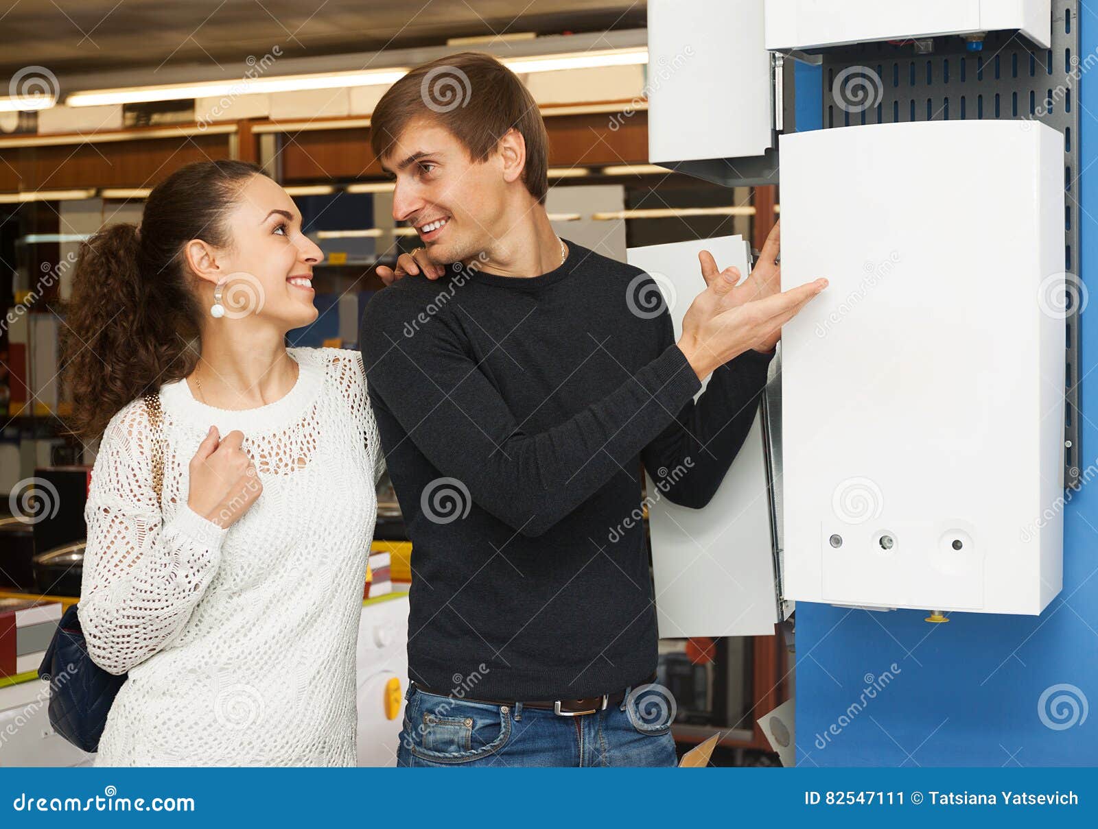 Customers Looking at Domestic Boilers Stock Image - Image of model ...