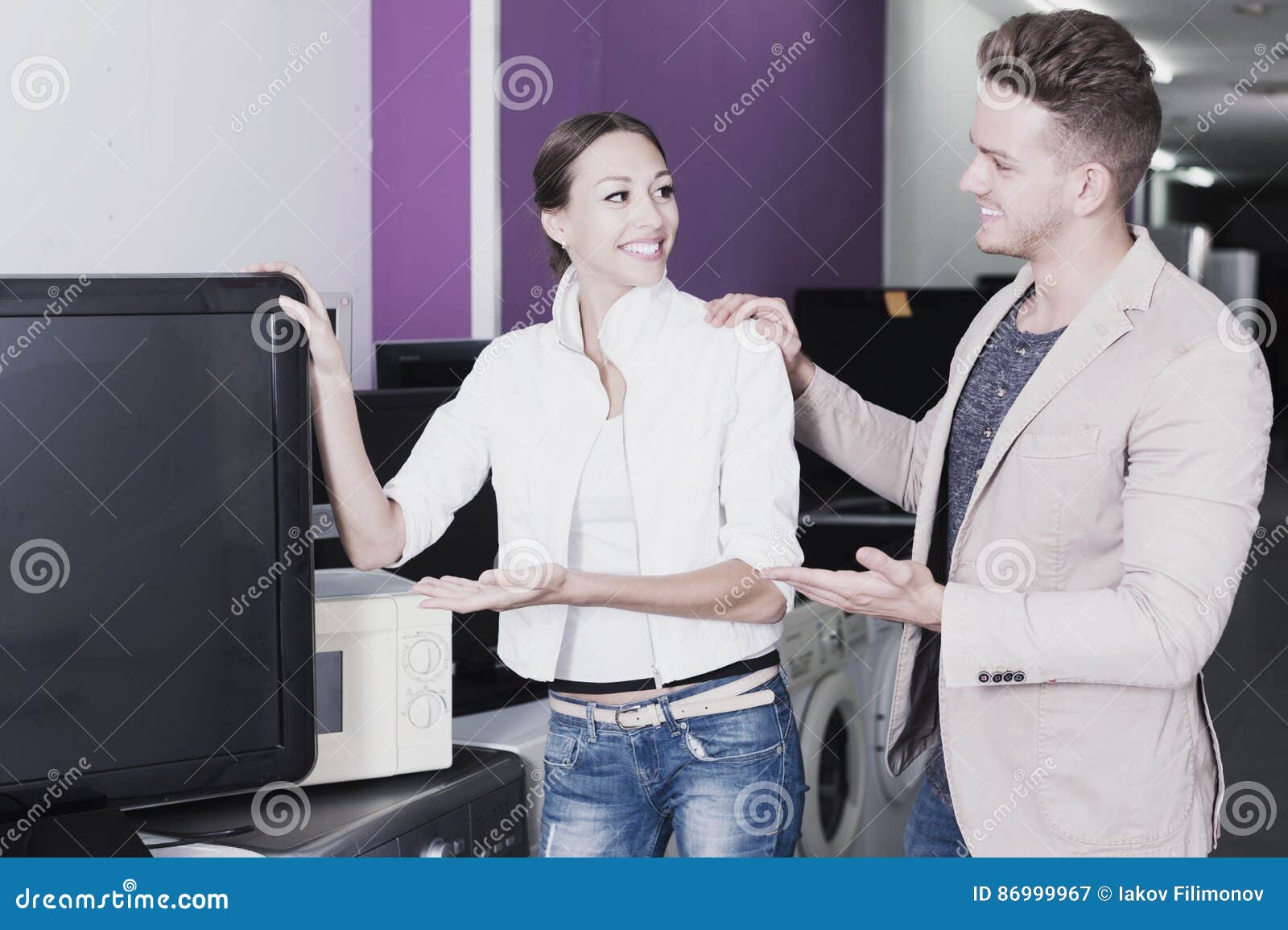 Customers selecting TV set stock image. Image of family - 86999967