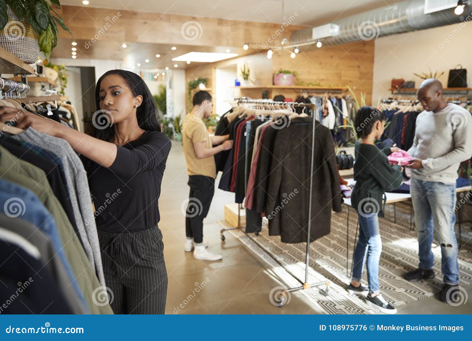 Customers and Staff in a Busy Clothes Shop Stock Photo - Image of busy ...