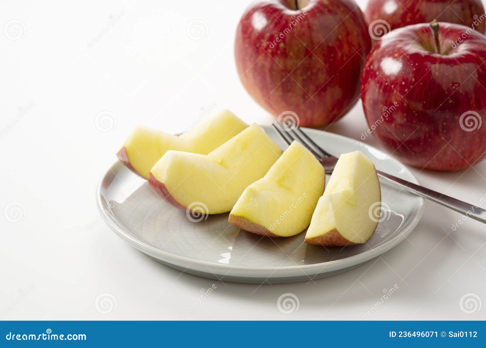 Cut Apples on a Plate Against a White Background Stock Image - Image of ...