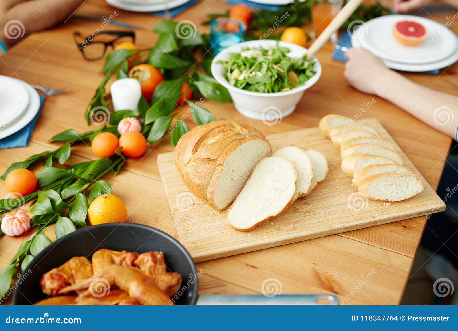 Cut bread served on table stock photo. Image of green - 118347764