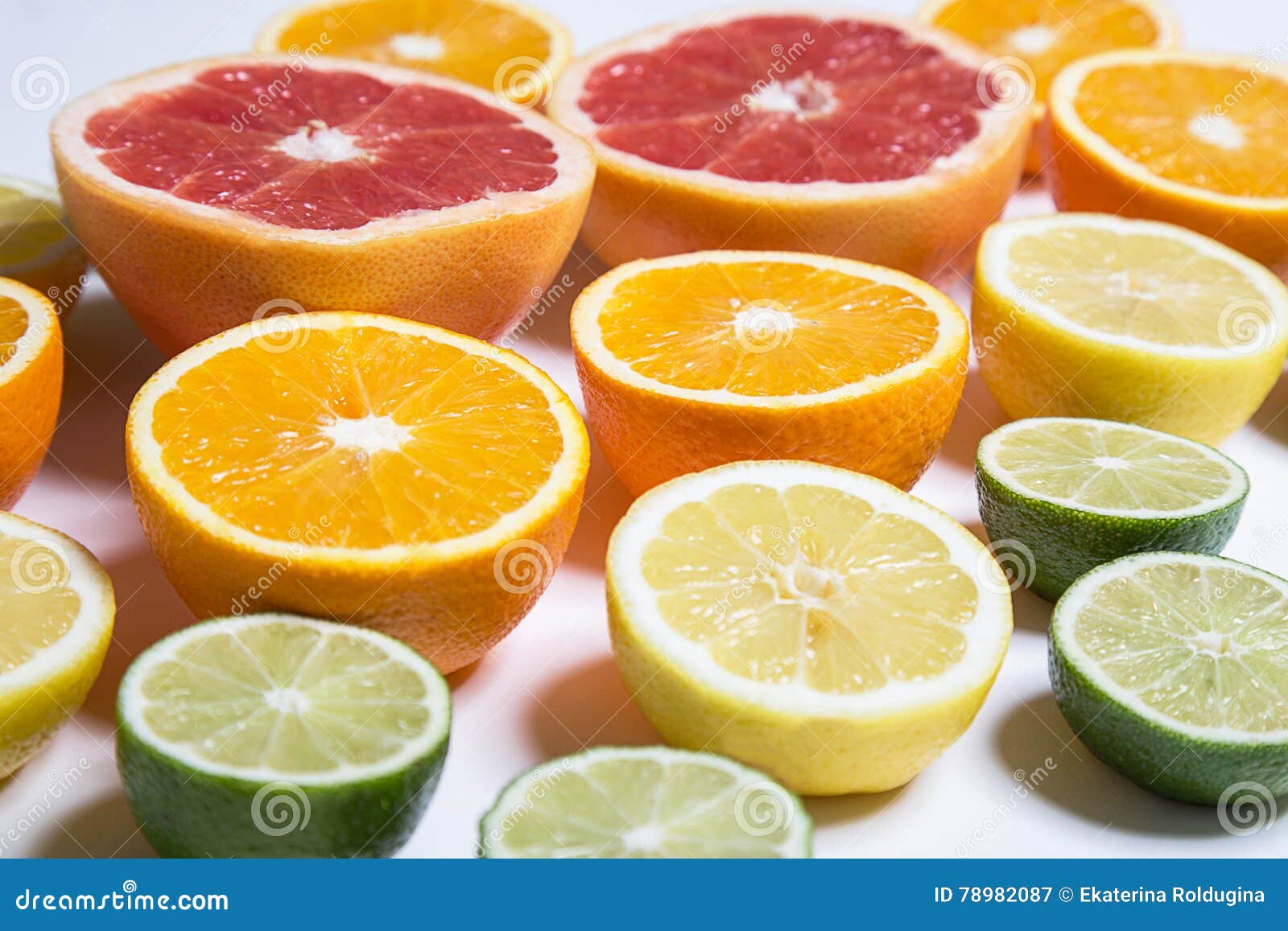 Cut Citruses of Different Colors on White. Sliced Lemon, Orange, Lime ...