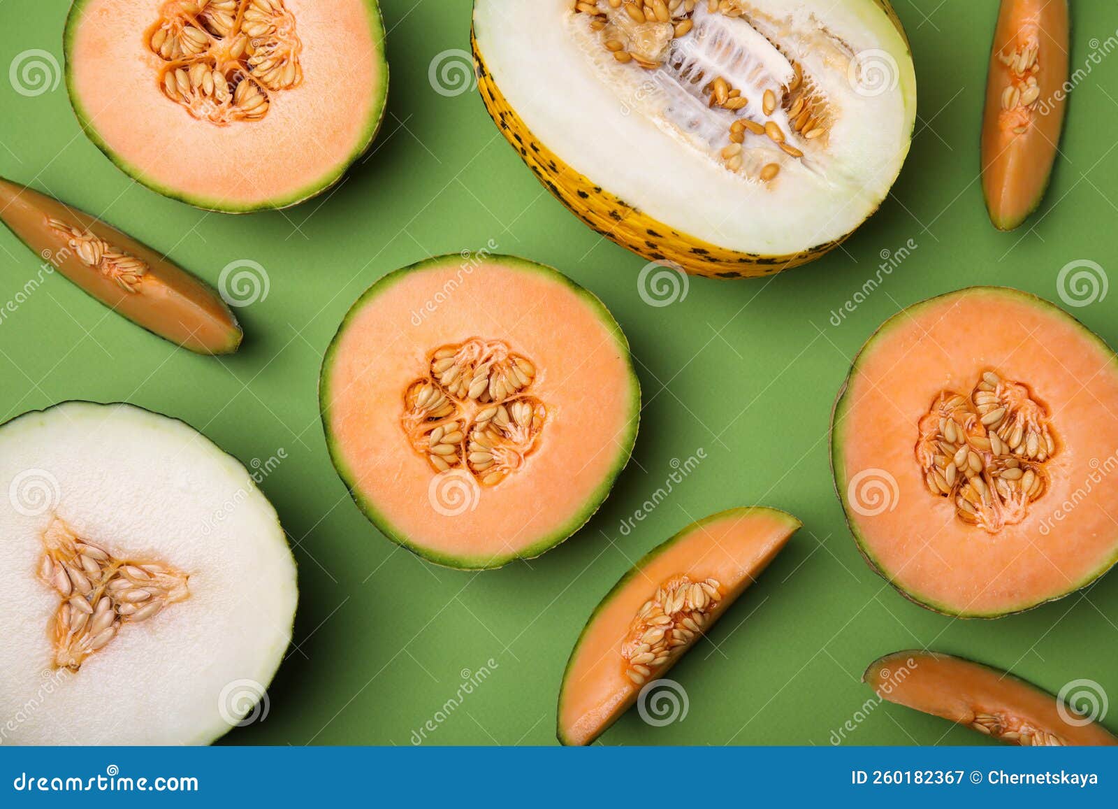 Cut Different Types of Melons on Green Background, Flat Lay Stock Image ...