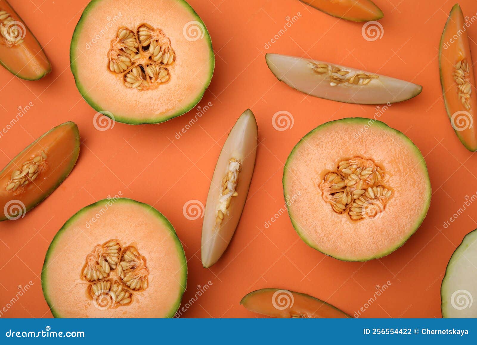 Cut Different Types of Melons on Orange Background, Flat Lay Stock ...
