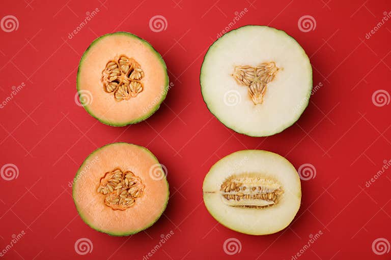 Cut Different Types of Melons on Red Background, Flat Lay Stock Image ...