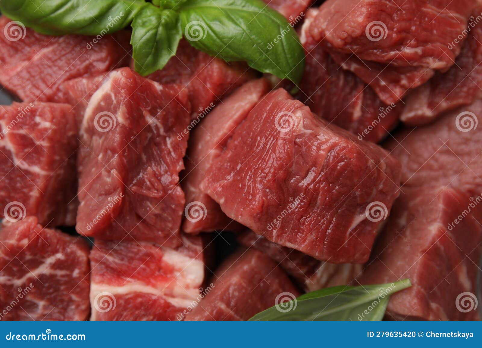 Cut Fresh Beef Meat with Basil Leaves As Background, Closeup Stock ...