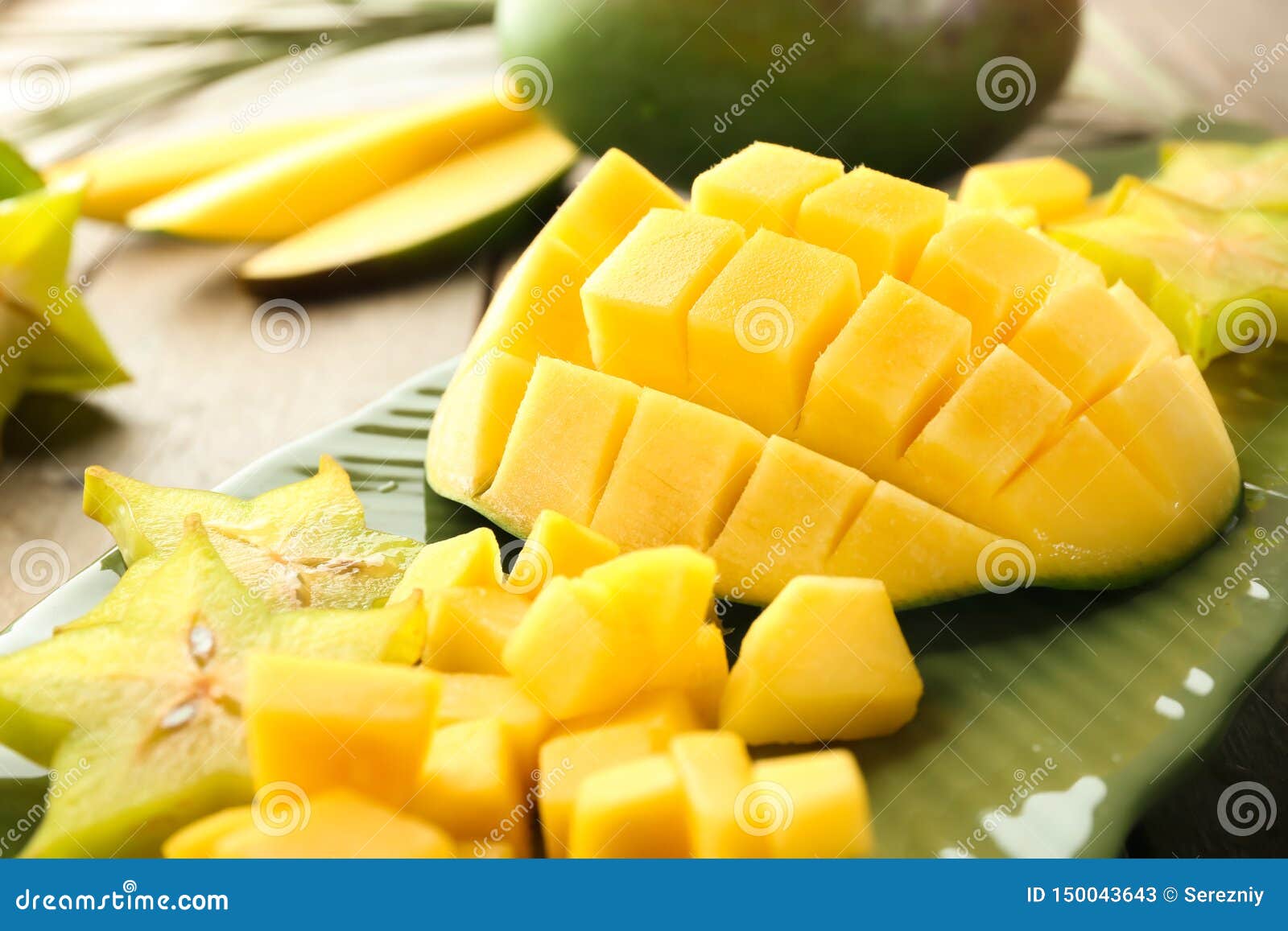 Cut Fresh Mango and Starfruit on Plate, Closeup Stock Image - Image of ...