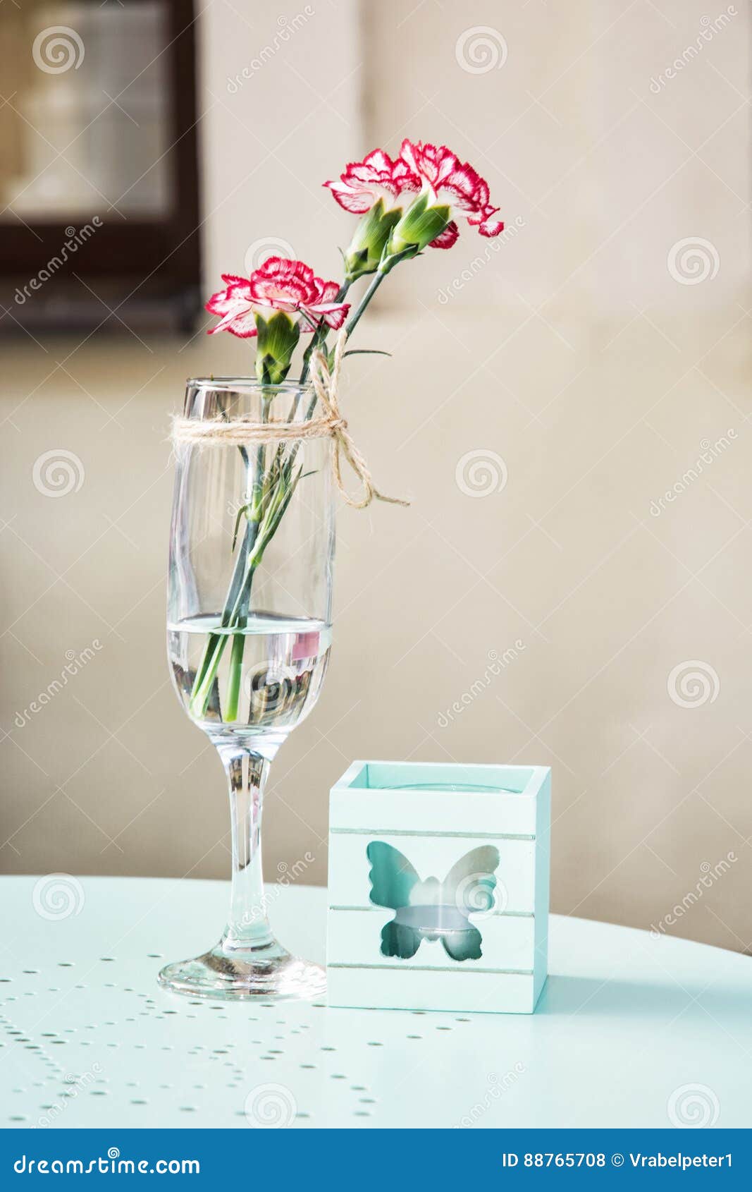 Cut Geranium Flower with Decorative Candle on the Table Stock Photo ...