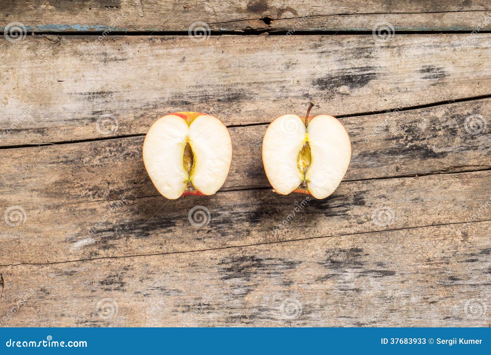 Cut in Half Apples Lying on Textured Weathered Wooden Table Stock Image ...