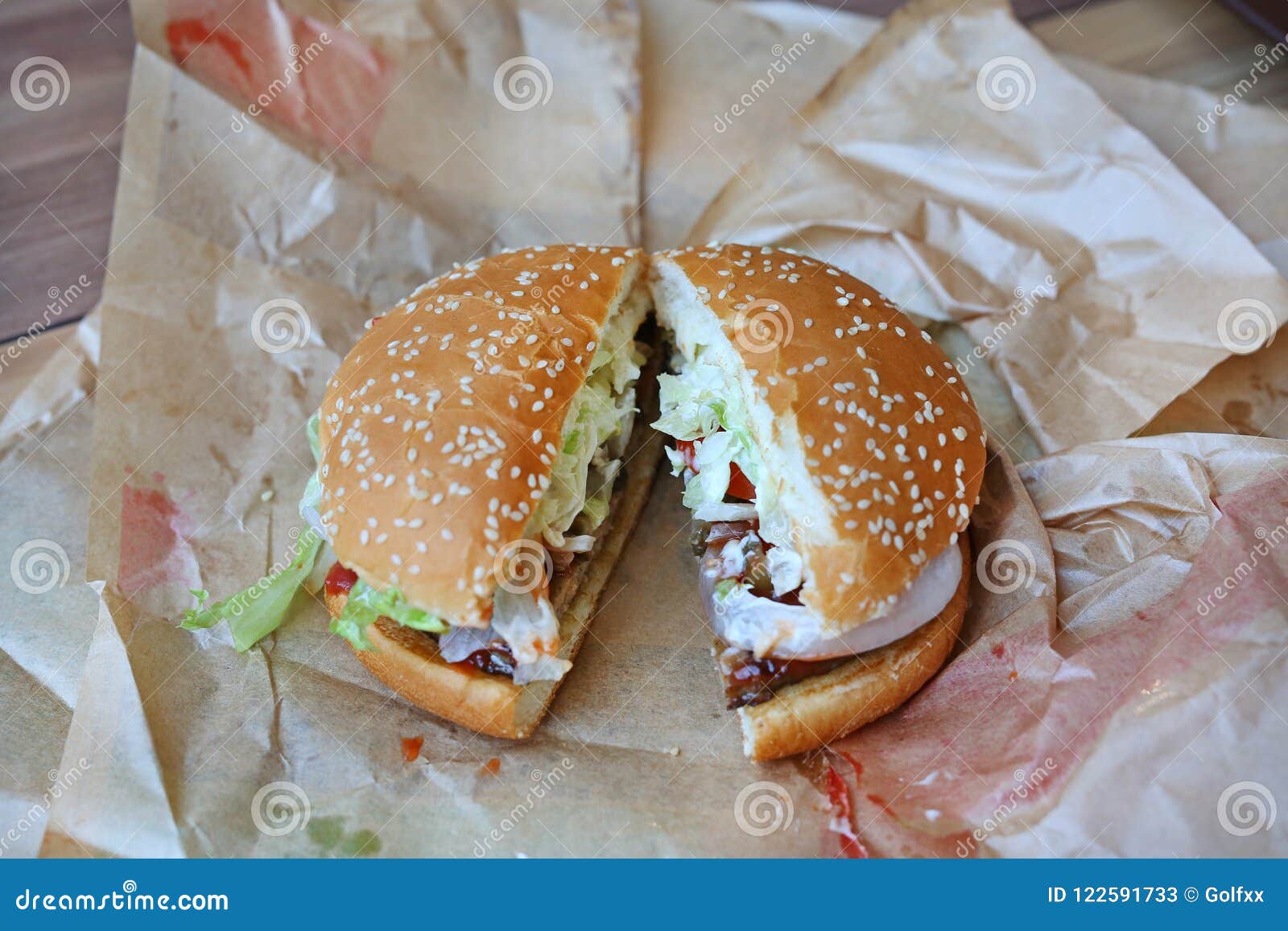 Cut Half Beef Burger on Paper Stock Image - Image of lettuce ...