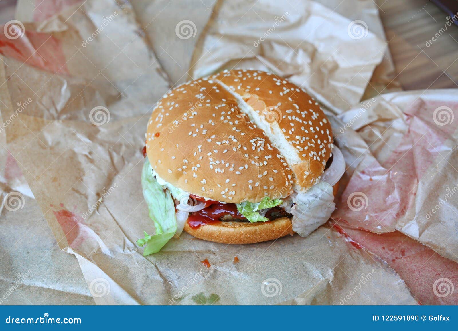 Cut Half Beef Burger on Paper Stock Photo - Image of ingredient, fries ...