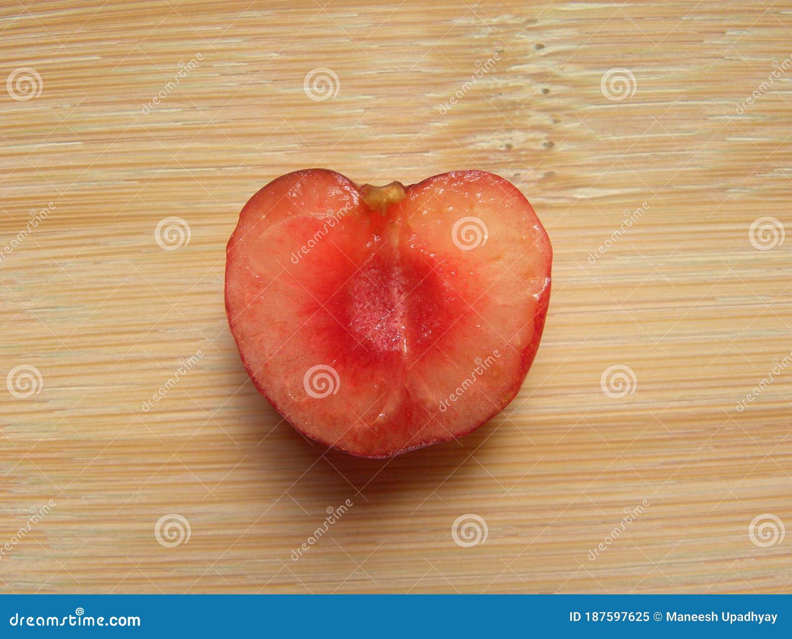 Cut half of Cherry stock image. Image of heart, detail - 187597625