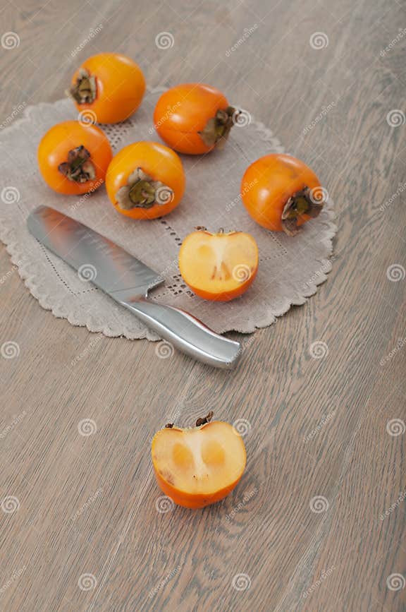 Cut in half kaki fruit stock image. Image of orange, delicious - 28036287