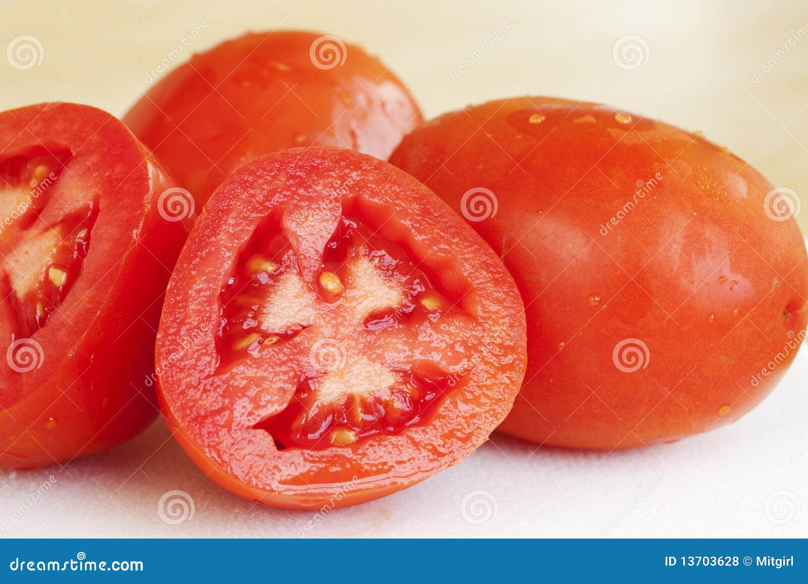 Cut Juicy Red Tomatoes stock photo. Image of fruit, seeds - 13703628