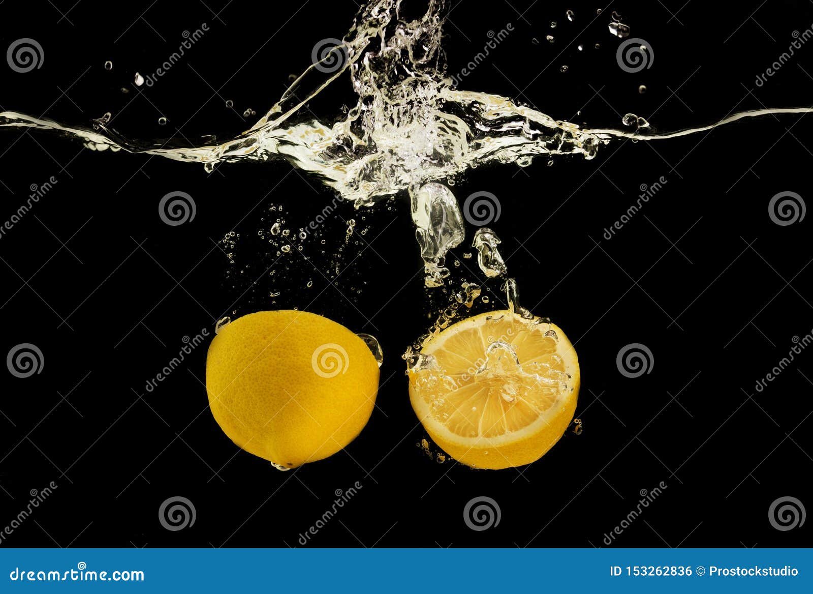 Cut Lemon Falling Deeply Under Water with Bubbles Stock Photo - Image ...