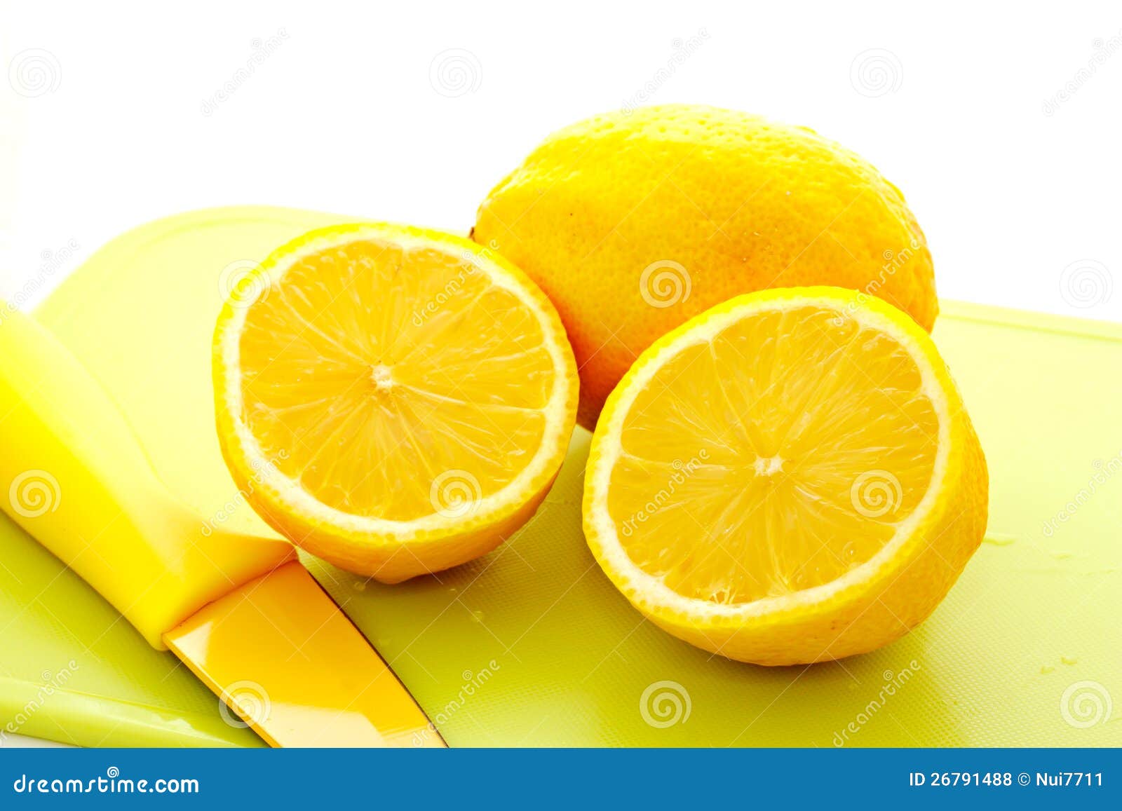 Cut lemon with knife 1 stock photo. Image of colorful - 26791488
