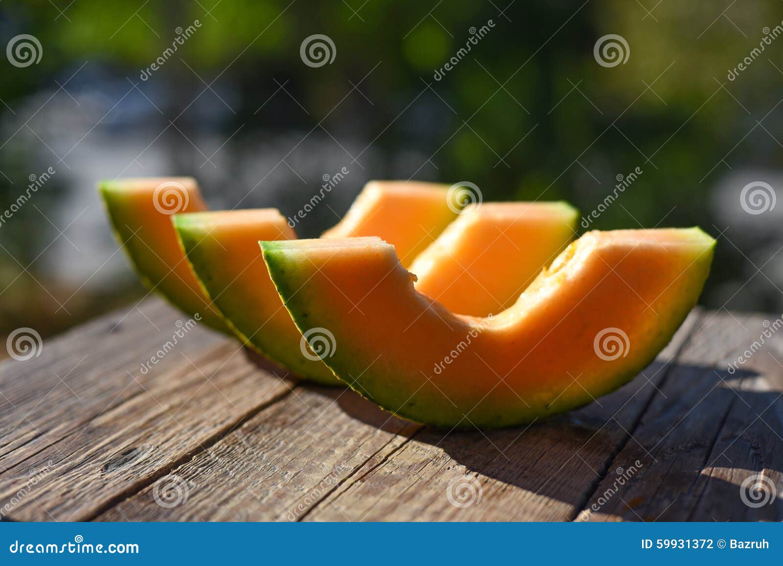 Cut melon segments stock photo. Image of vegetable, table - 59931372