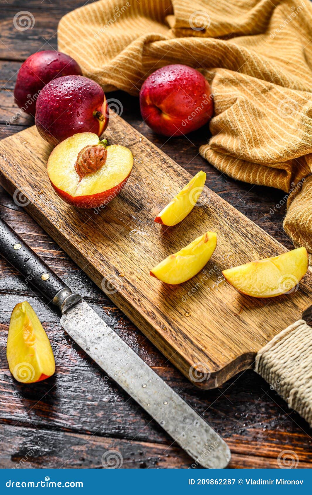 Cut Nectarines on a Wooden Cutting Board. Wooden Background Stock Image ...