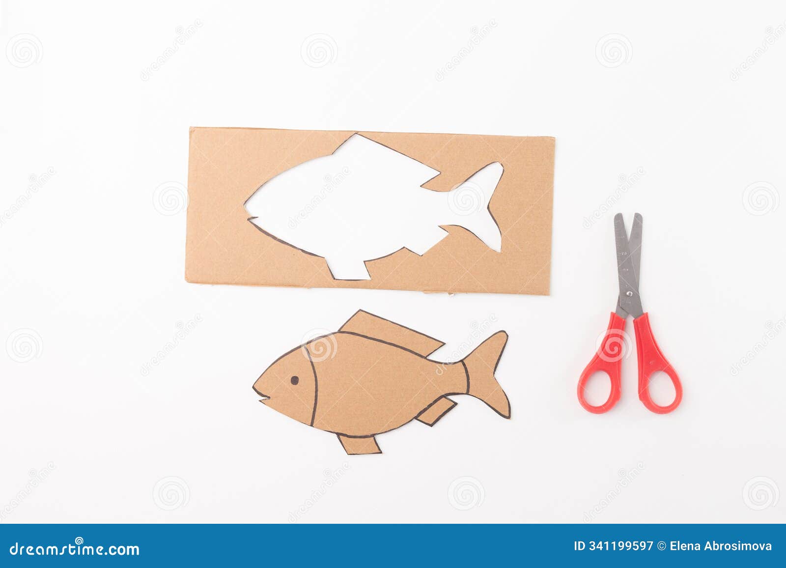 Cut Out Fish Shape Itself, and a Pair of Red Handled Scissors, Top View ...