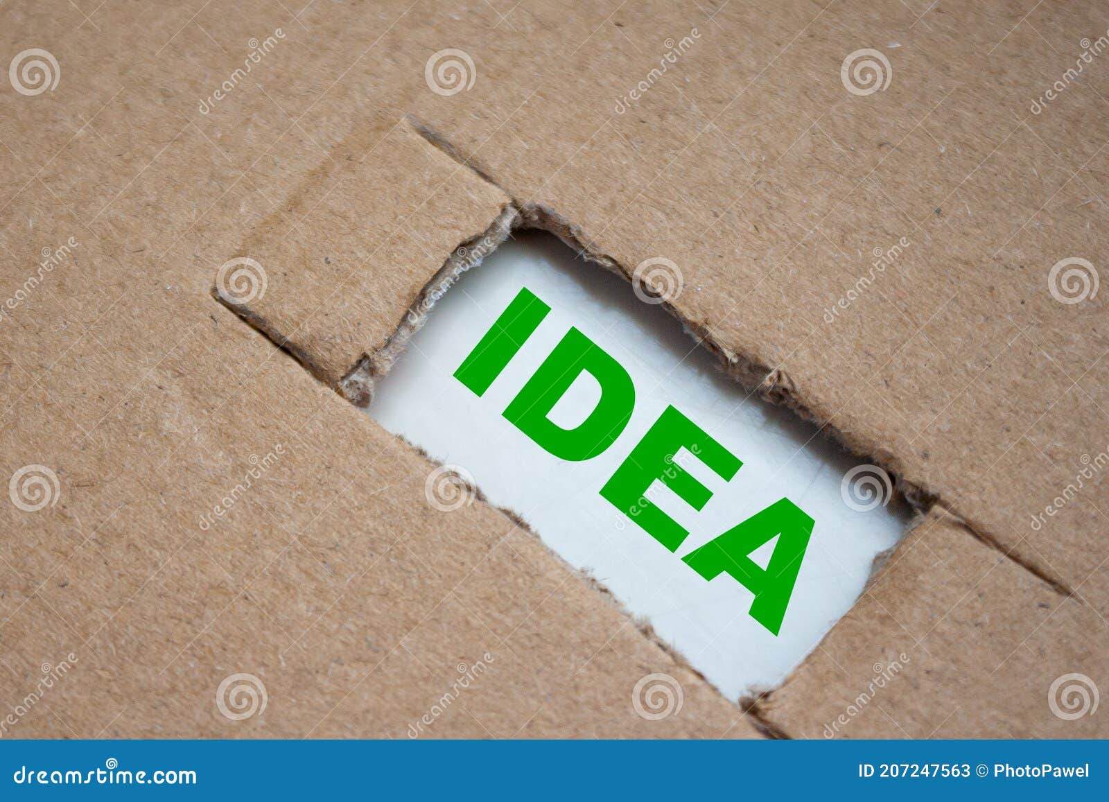 A Cut-out Hole in the Paper Cardboard, and Under it a Piece of Paper ...