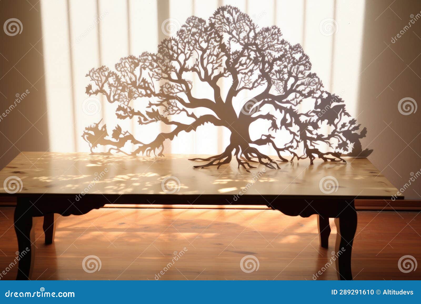 Cut-out Paper Tree with Dancing Shadows on a Wooden Table Stock Photo ...