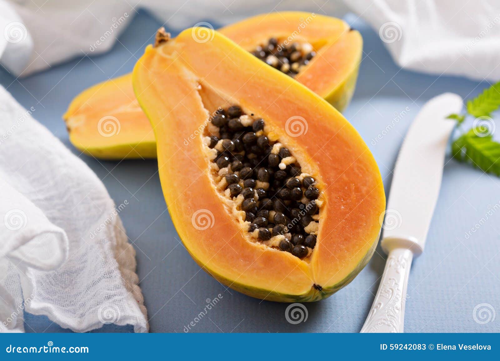 Cut papaya on a blue table stock image. Image of food - 59242083