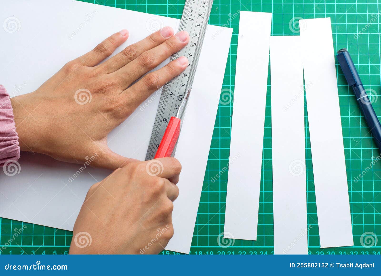 Cut the Paper with the Red Cutter on the Cutter Mat Stock Photo - Image ...