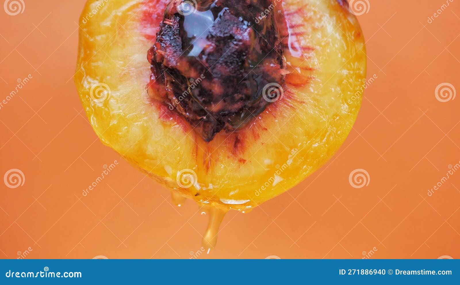 Cut Peach with Juice Dripping on an Orange Background Stock Photo ...
