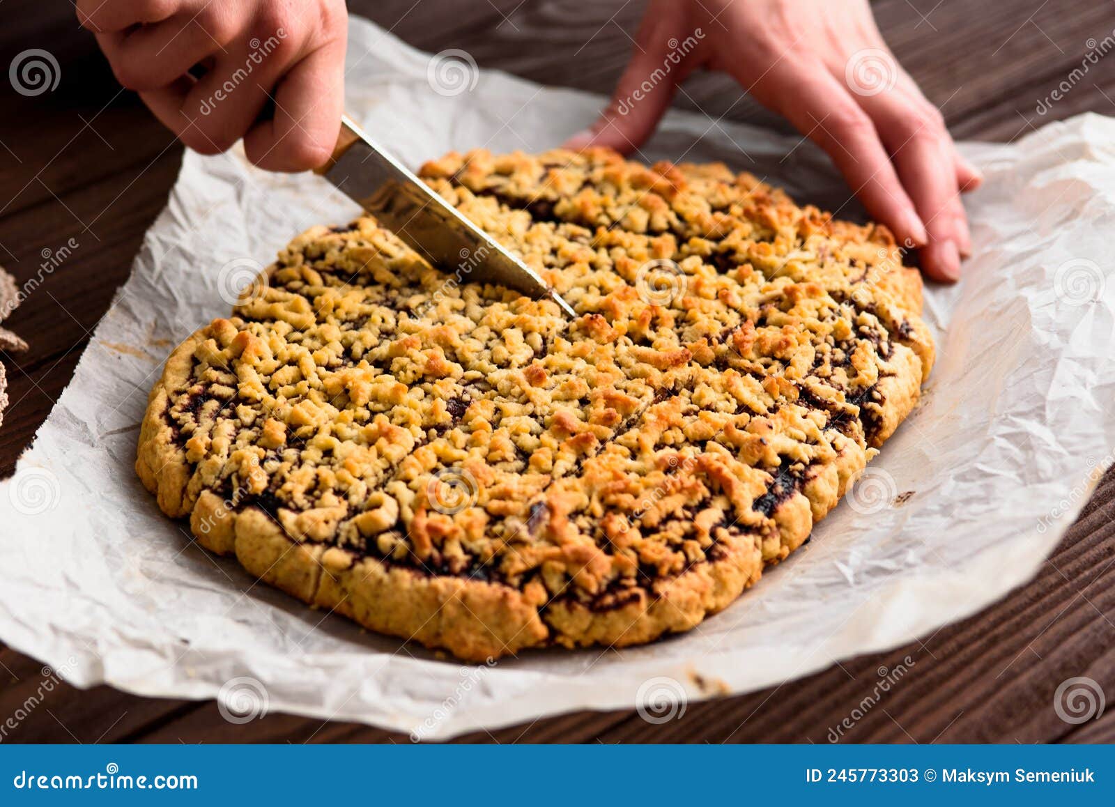 Cut Pie into Portion Pieces for Cooking on a Wooden Brown Table. View ...