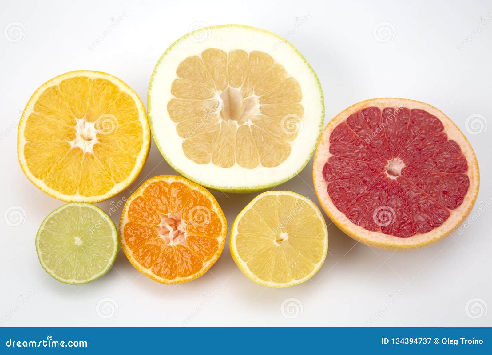 Cut Pieces of Different Citrus Fruits on White Background Stock Image ...