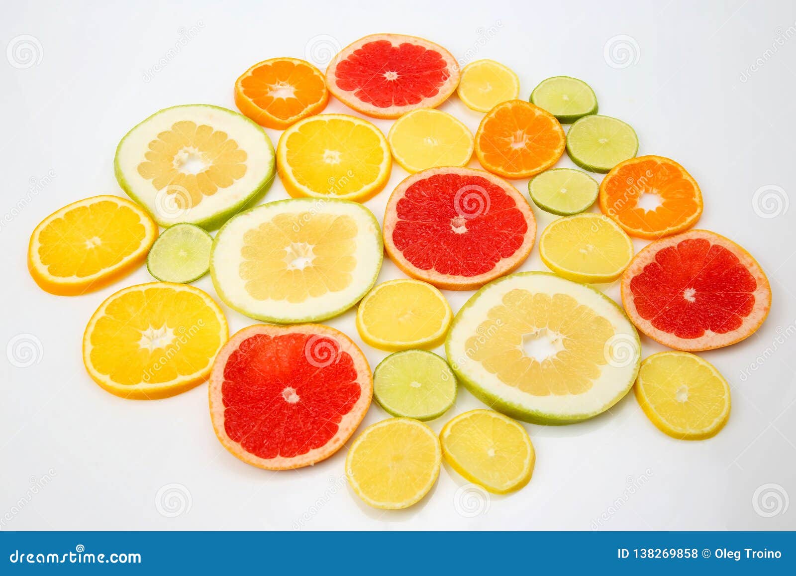 Cut Pieces of Different Citrus Fruits on White Background Stock Photo ...