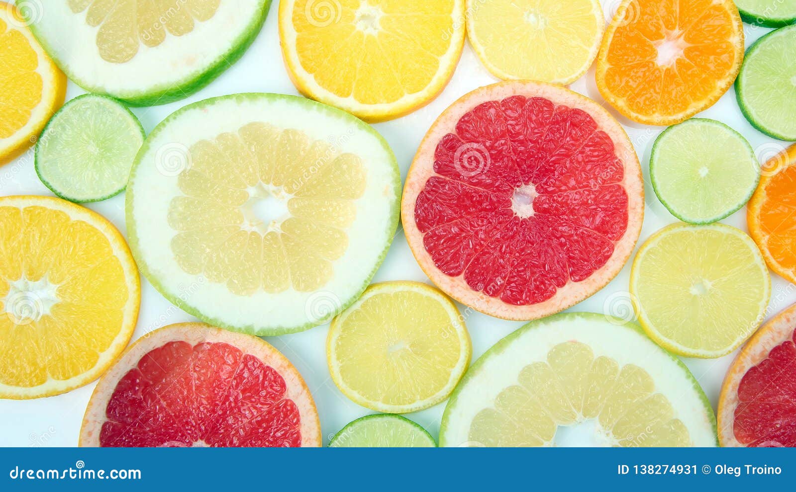Cut Pieces of Different Citrus Fruits on White Background Stock Image ...