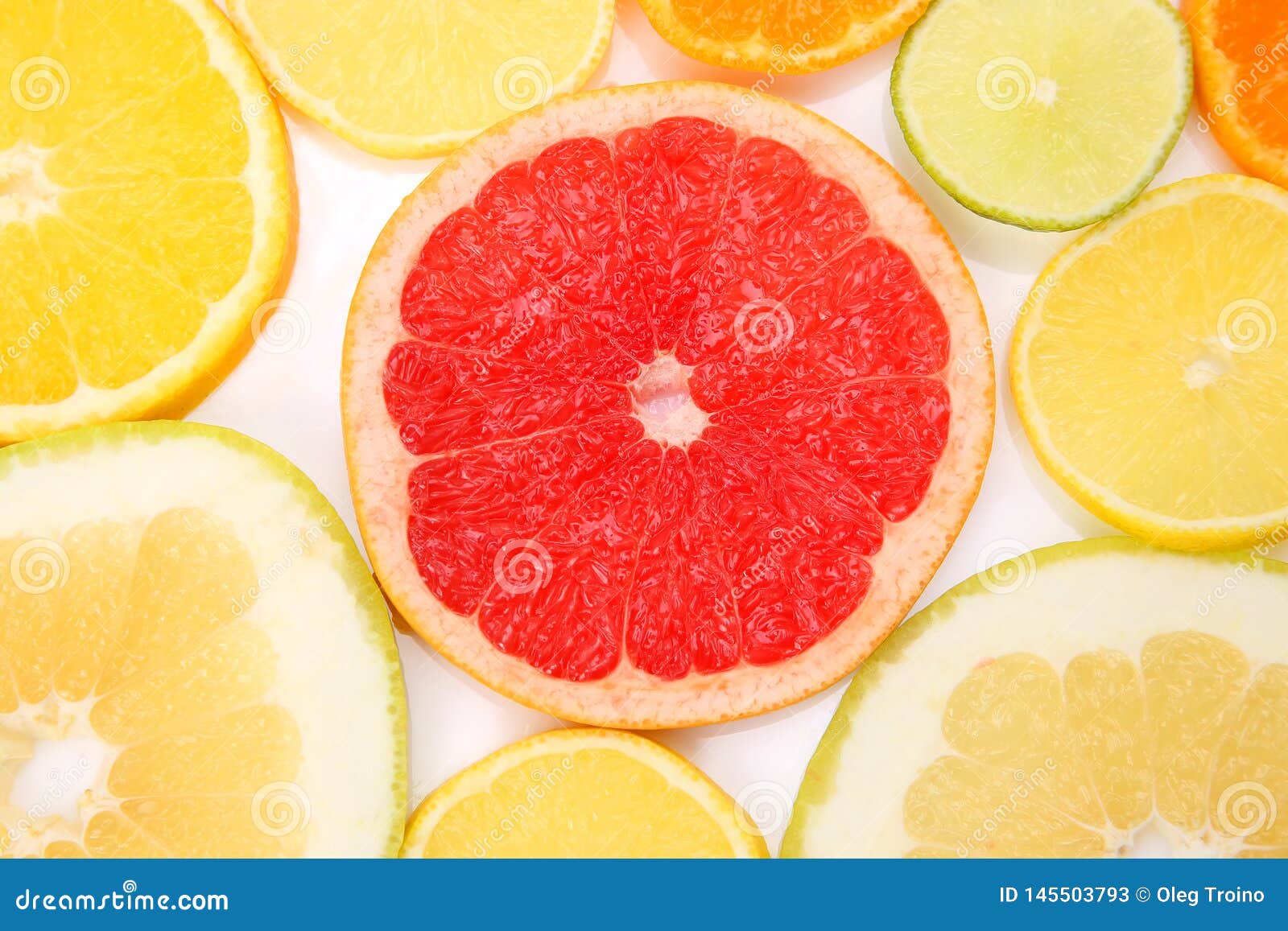 Cut Pieces of Different Citrus Fruits on White Background Stock Image ...