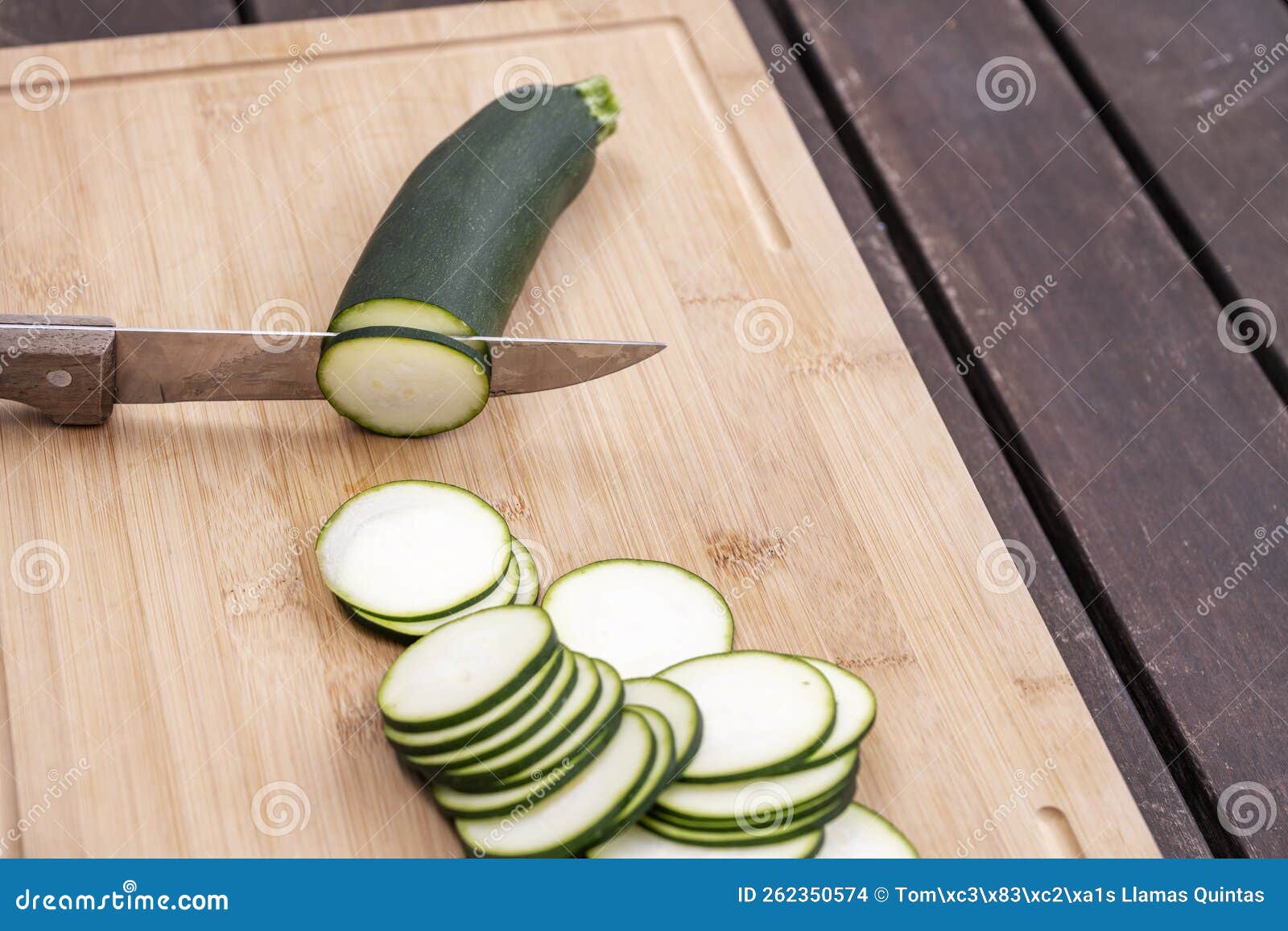 Cut a Raw Zucchini with a Sharp Knife and Stack Many Thin Slices on a ...