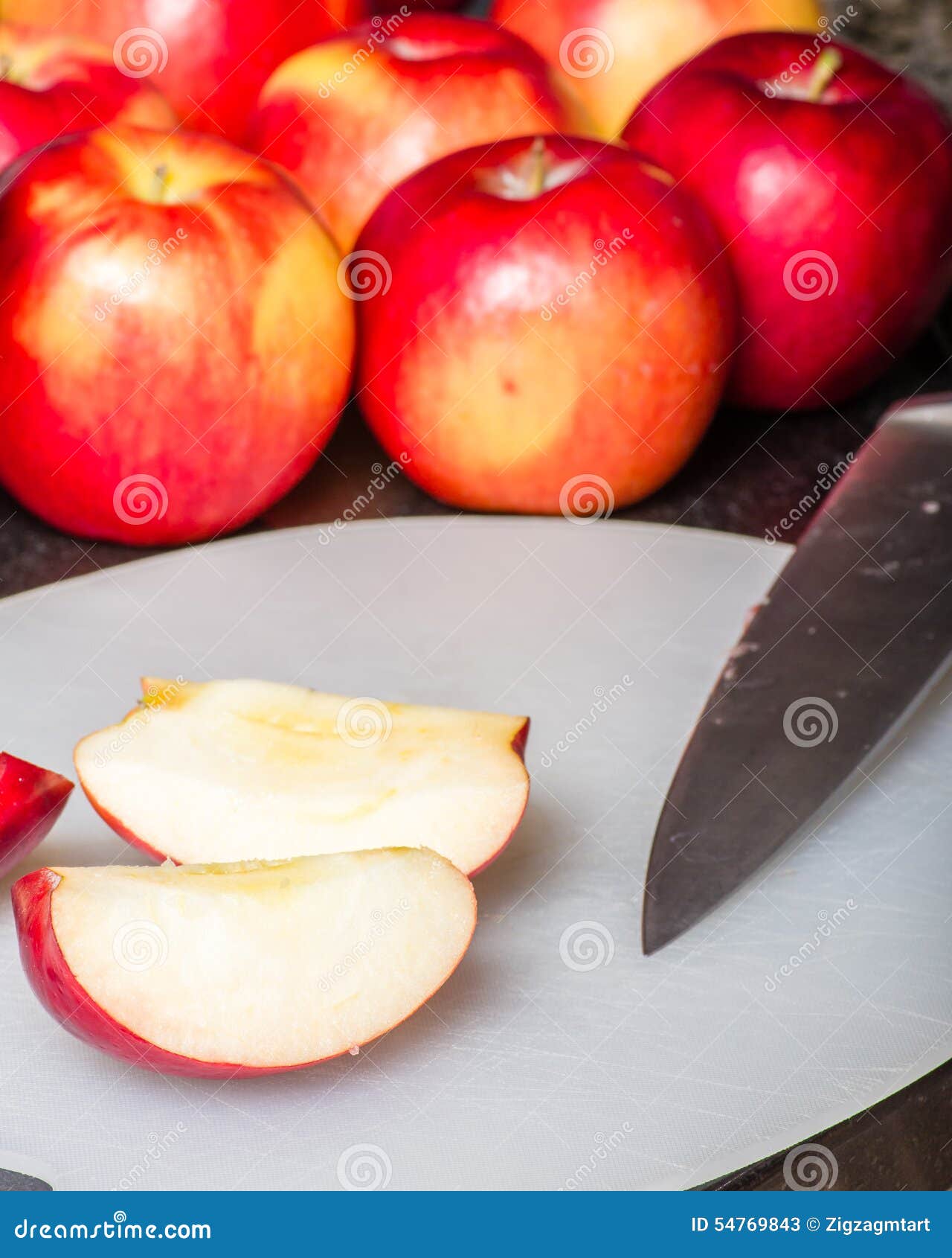 Cut red apples with knife stock image. Image of baking - 54769843