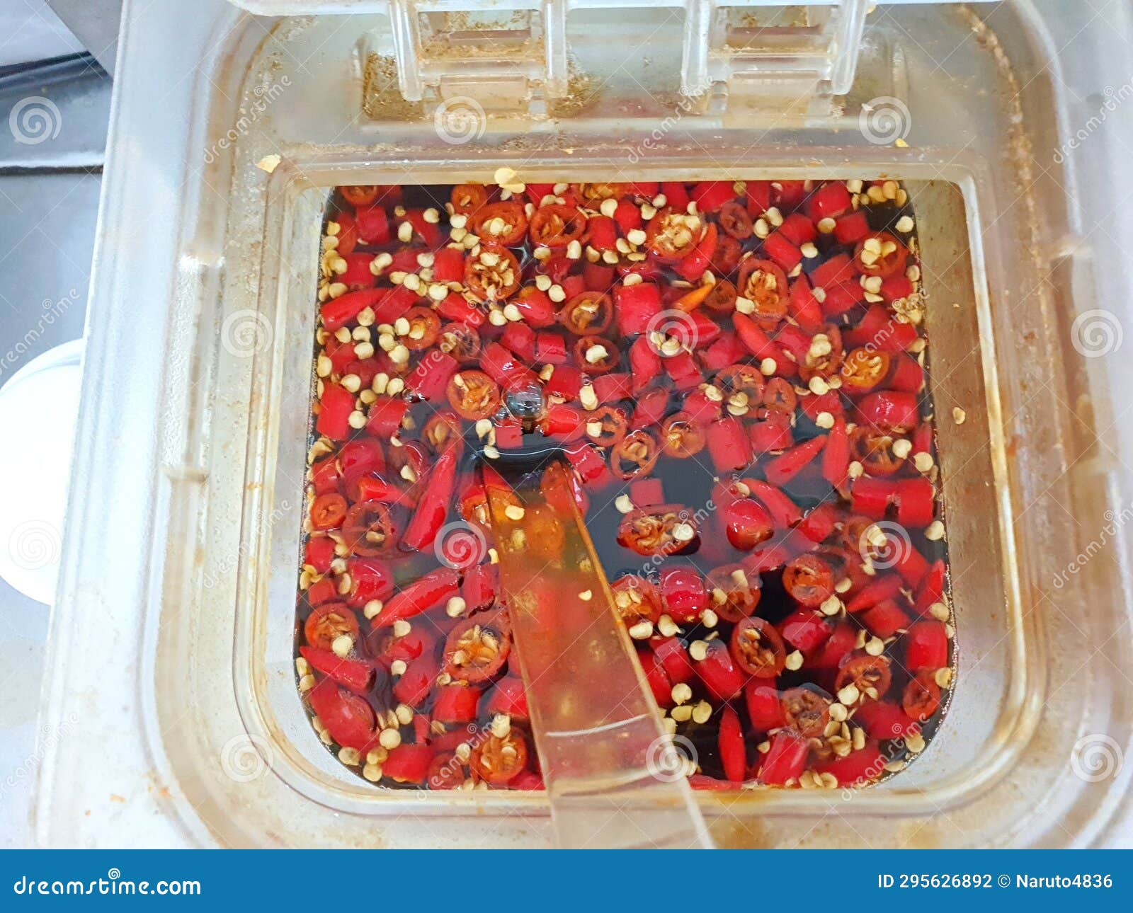 Cut Red Chilli in Soy Sauce Stock Photo - Image of food, brown: 295626892