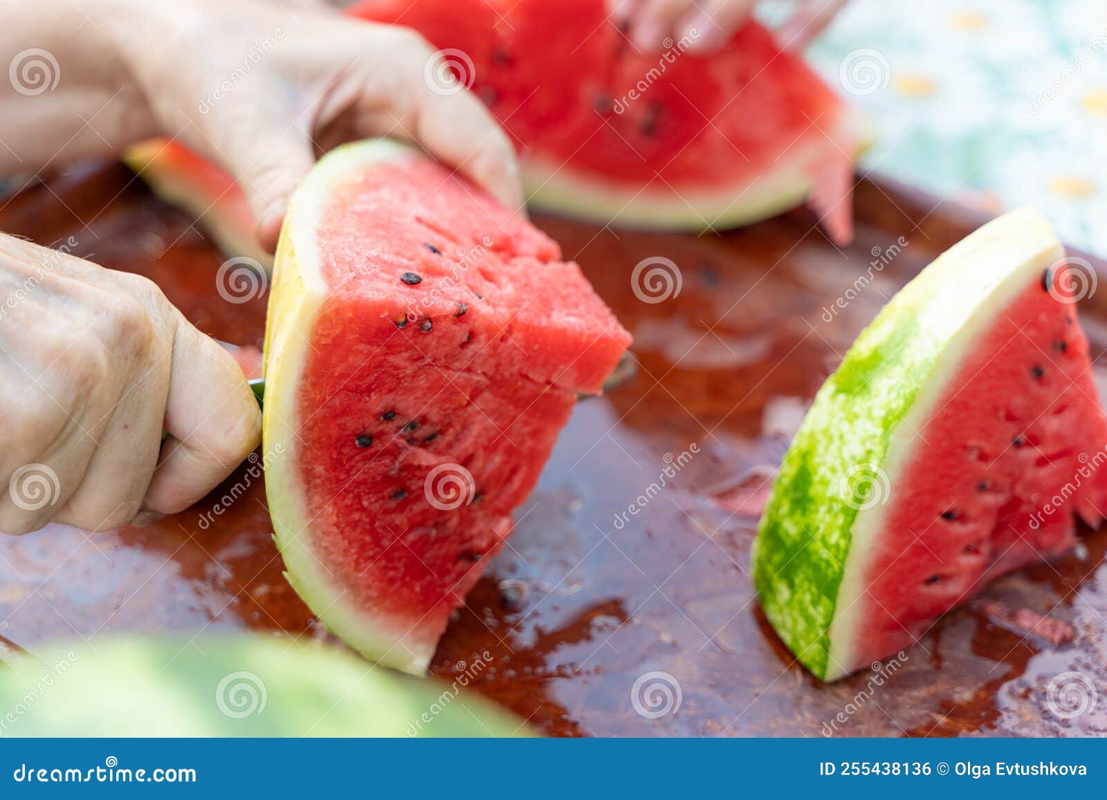 Cut a Red Watermelon into Pieces with a Knife Stock Photo - Image of ...