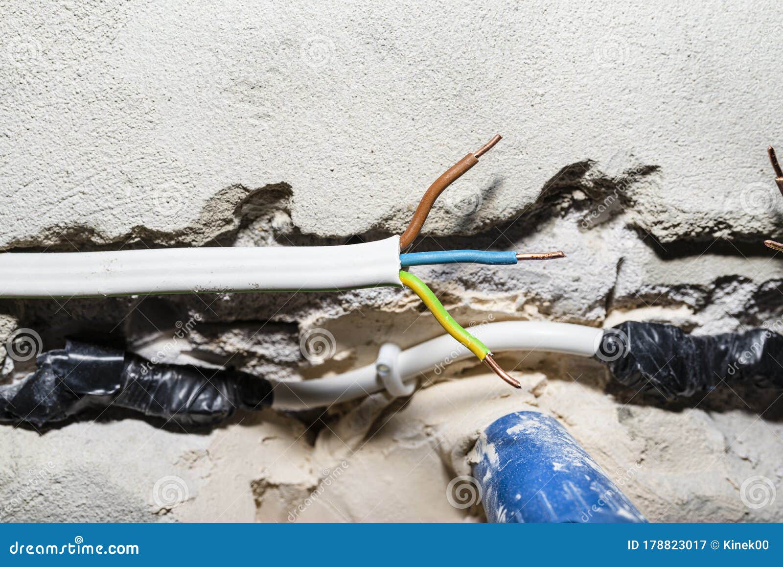 Cut Single-phase Cable in the Wall of the House. Phase, Neutral and ...