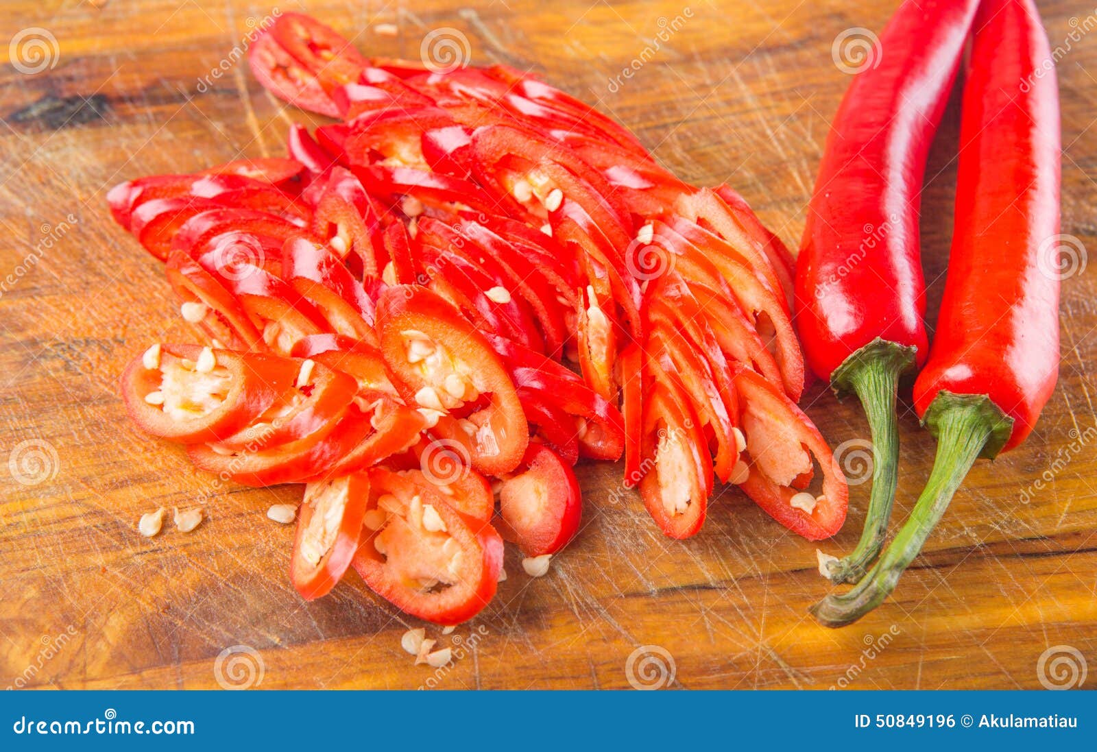 Cut Slices of Red Chili on Cutting Board VI Stock Photo - Image of ...