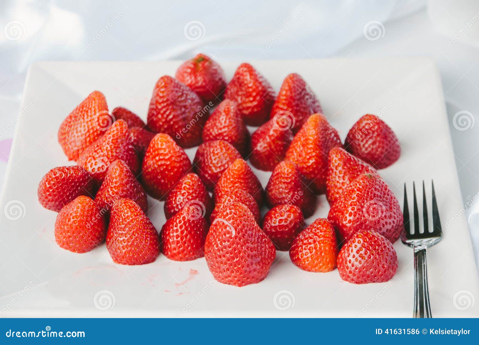 Cut Strawberries on Plate stock photo. Image of strawberries - 41631586