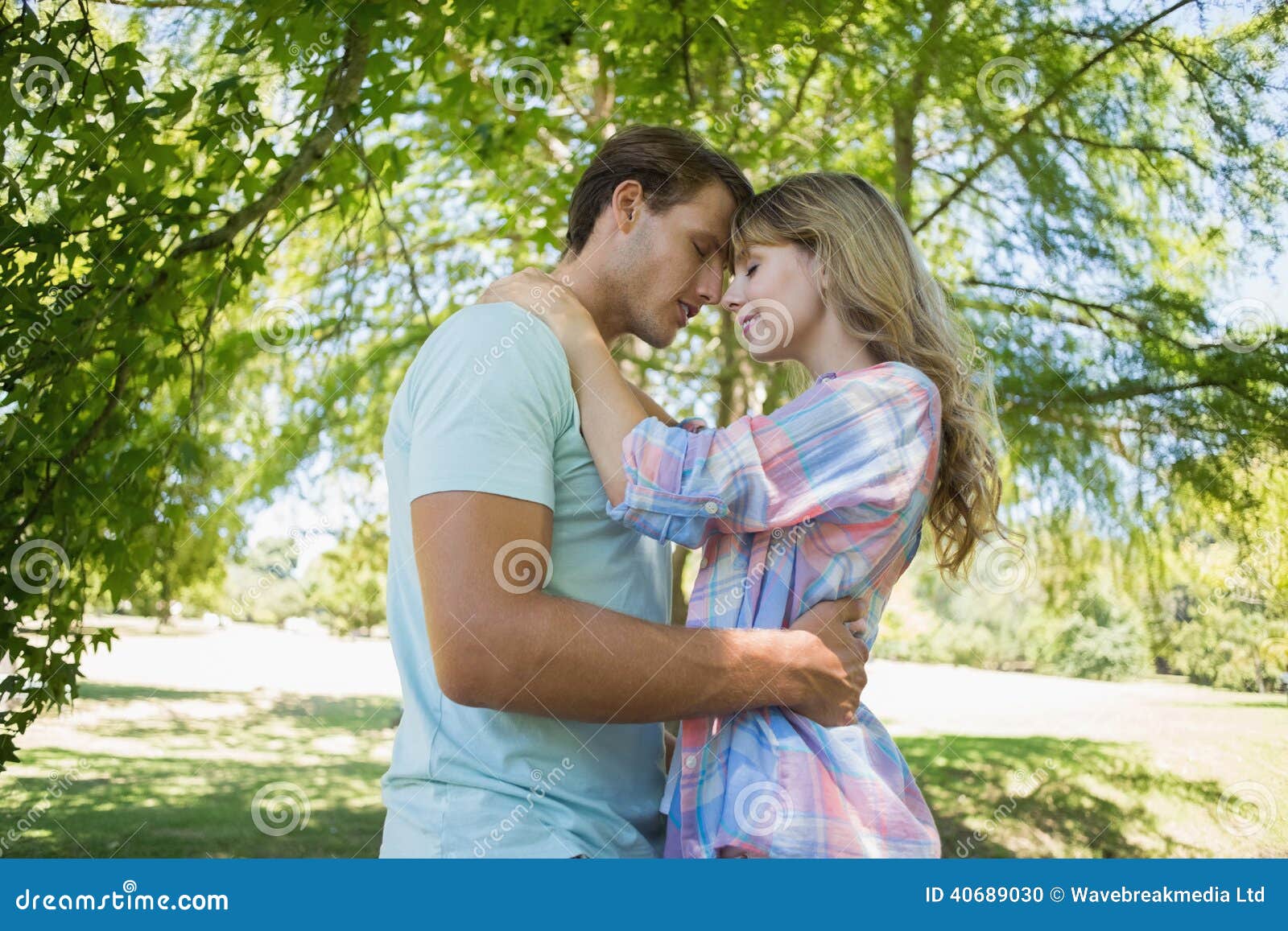 Cute Affectionate Couple Hugging in the Park Stock Photo - Image of ...