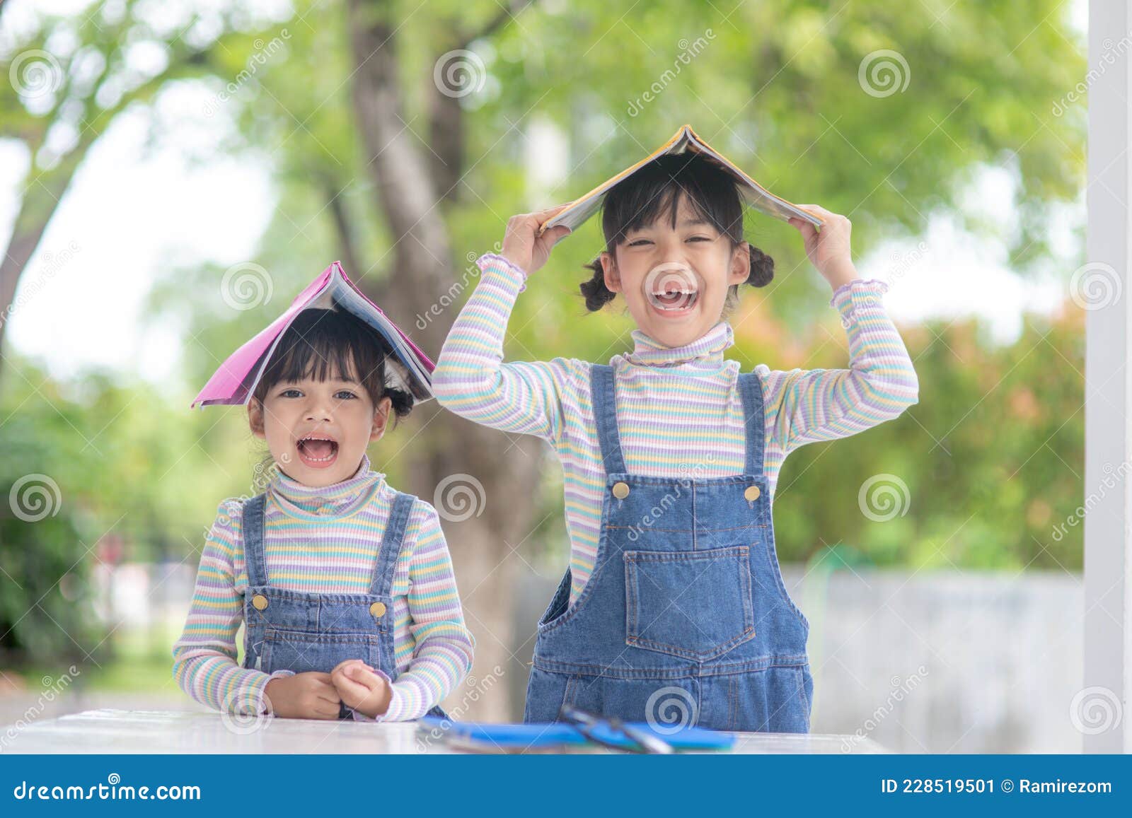 Cute Asian Children Reading a Book on the Table Stock Image - Image of ...