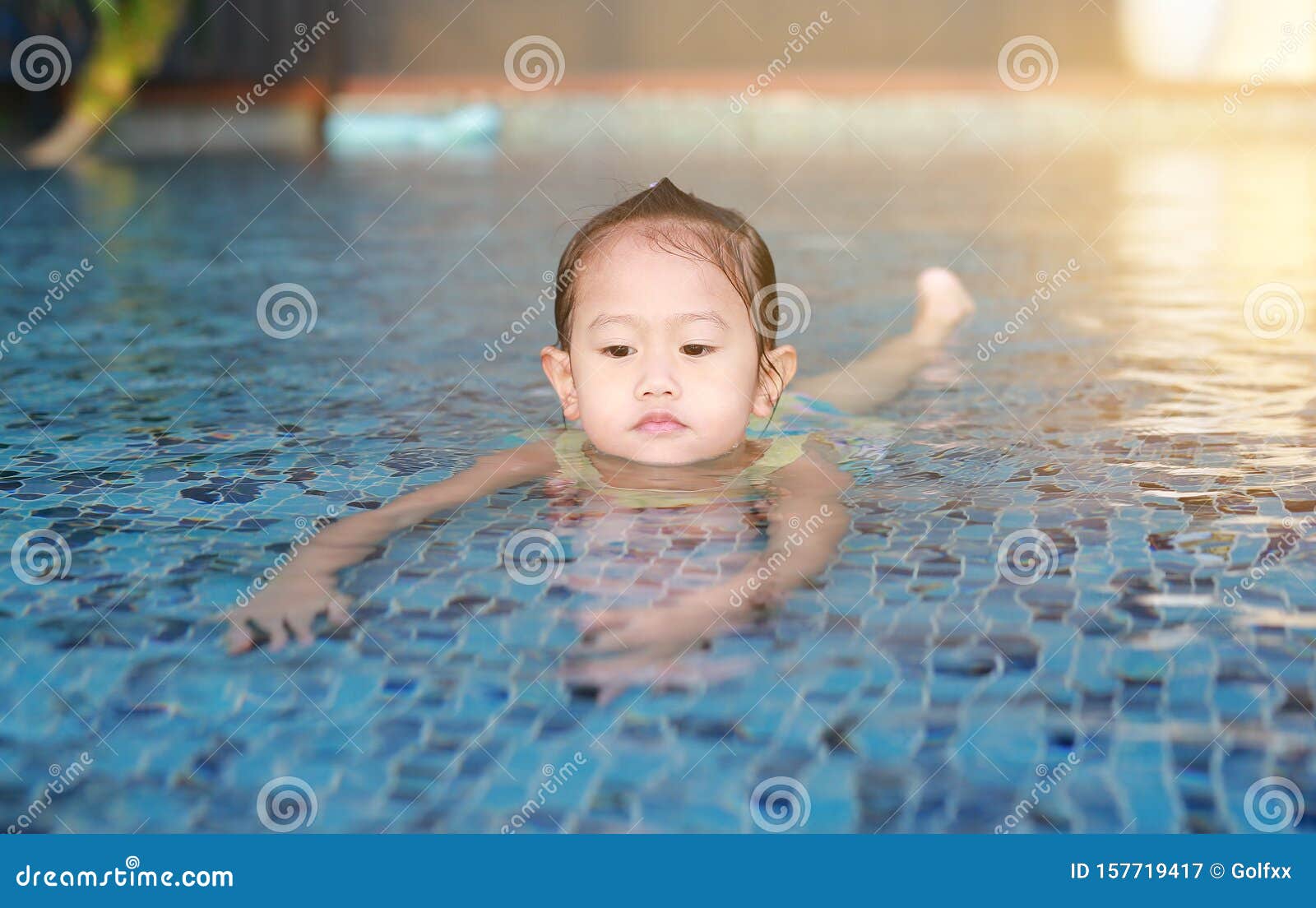 Cute Asian Girl Lying in the Pool Stock Image - Image of active, lying ...