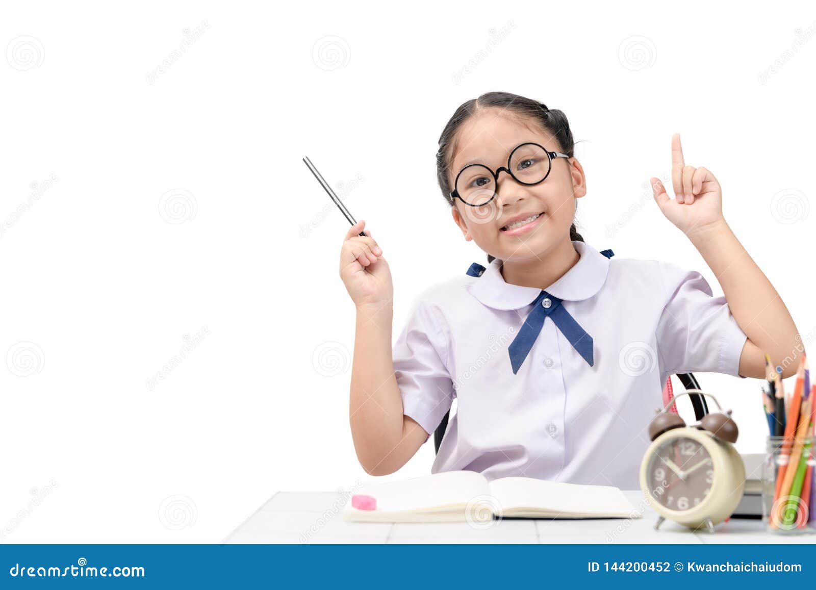 Cute Asian Student Doing Homework on Table Isolated Stock Photo - Image ...