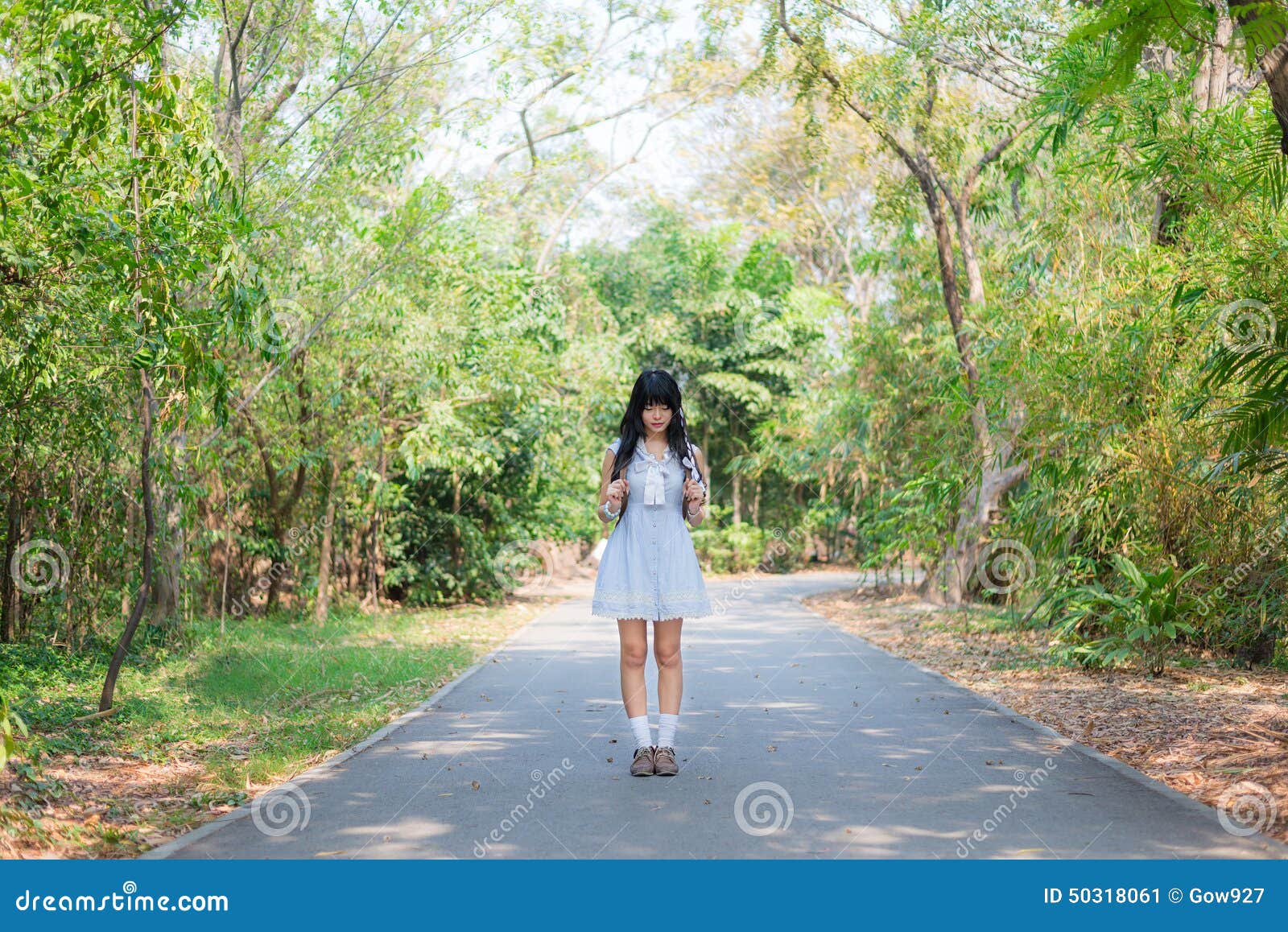 A Cute Asian Thai Girl is Standing on a Forest Path Alone Stock Image ...